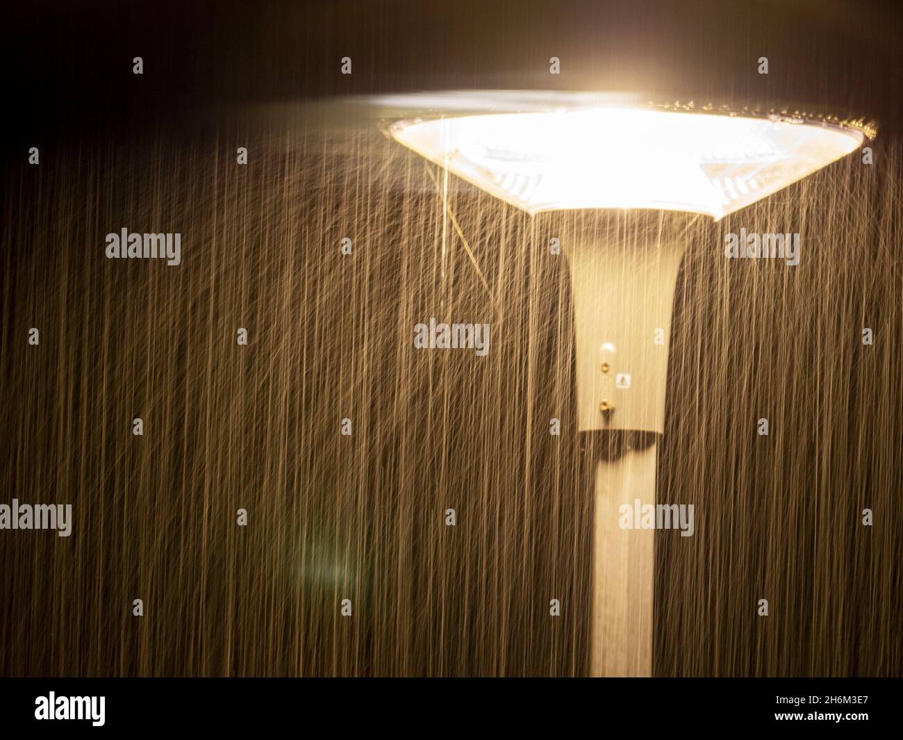 Heavy rain falling on a street lamp in Ambleside, Lake District, UK ...
