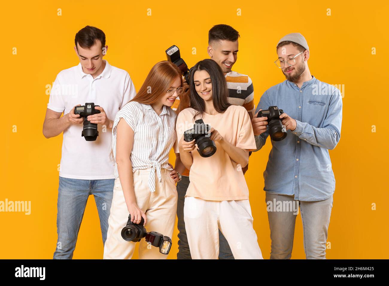 Group of photographers on color background Stock Photo - Alamy
