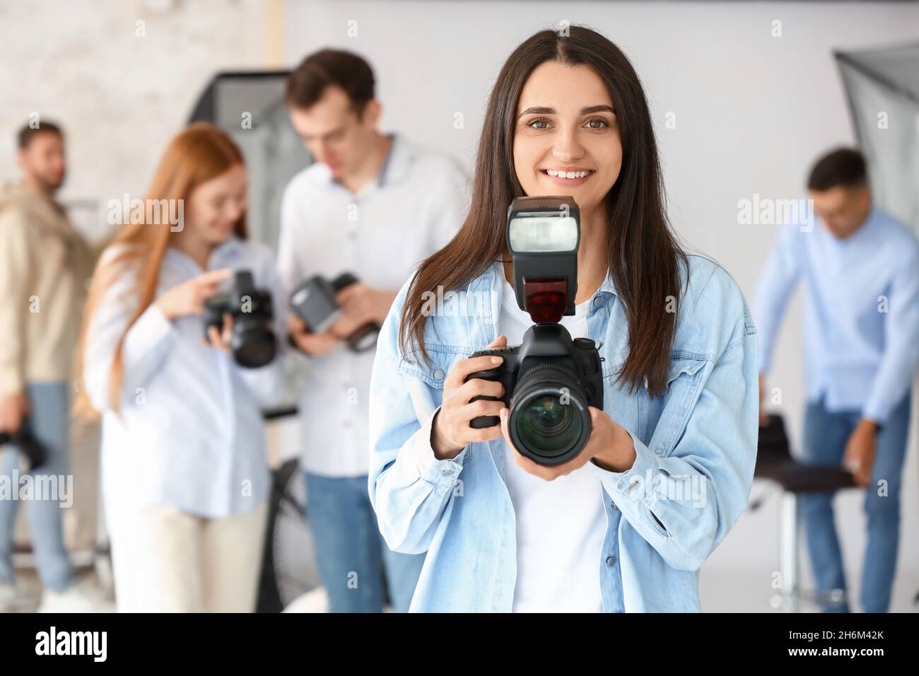 Female photographer during classes in studio Stock Photo - Alamy