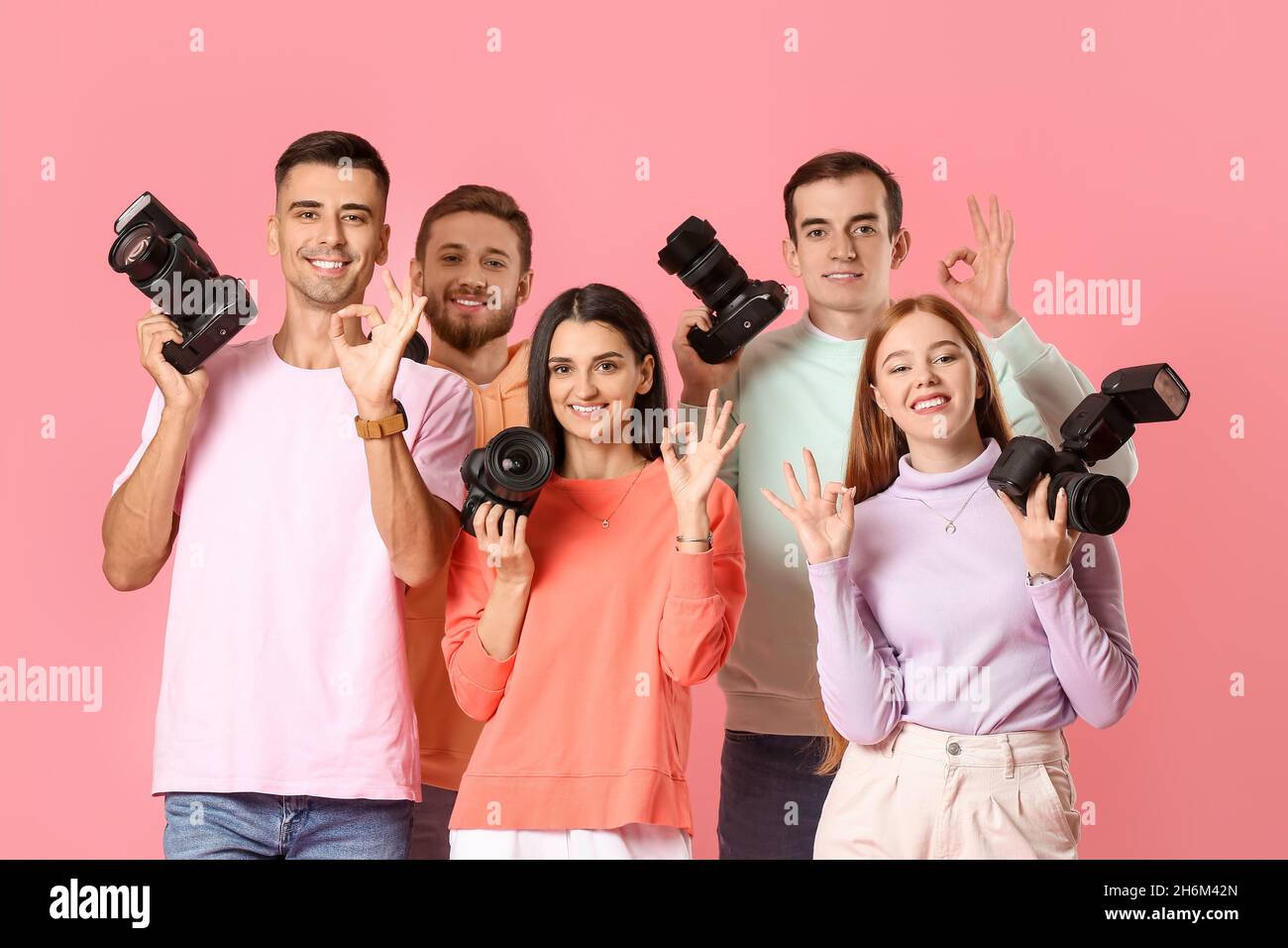 Group of photographers on color background Stock Photo - Alamy