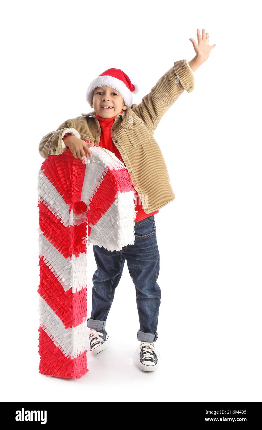 Cute little boy with candy cane pinata on white background Stock Photo ...