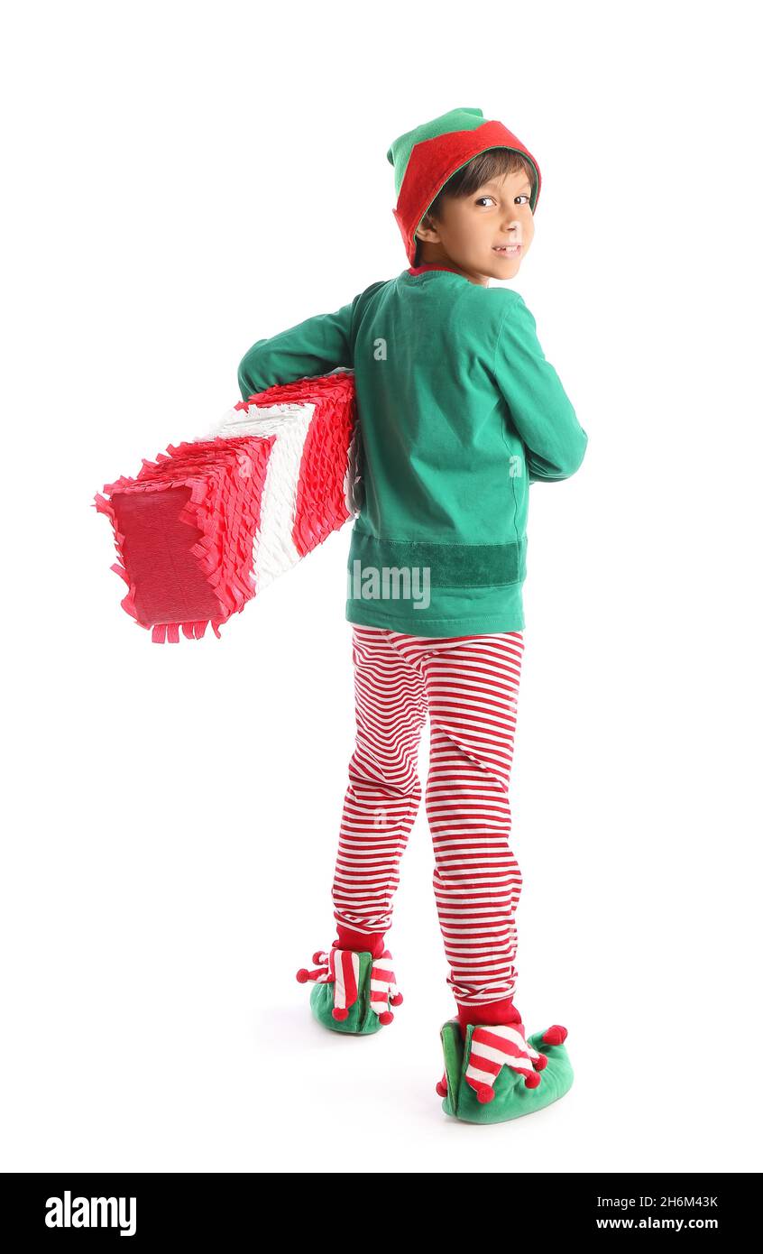 Cute little boy dressed as elf with candy cane pinata on white ...