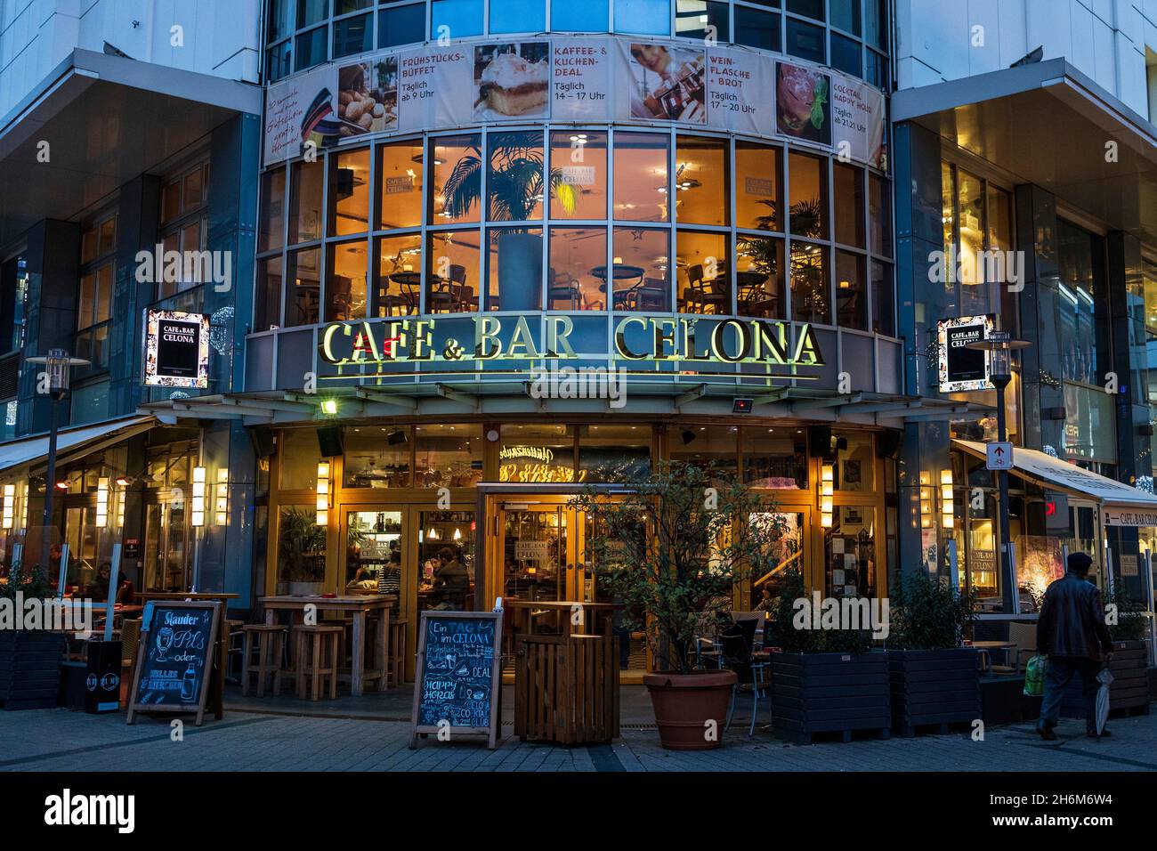 Exterior of Cafe and Bar Celona at dusk, Kennedyplatz, Essen, Ruhr Area ...