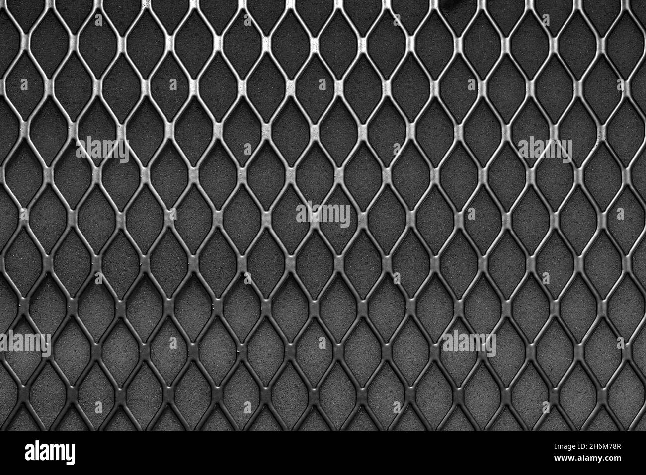 Metal grid with geometric pattern of rhombi, background. Black metallic ...