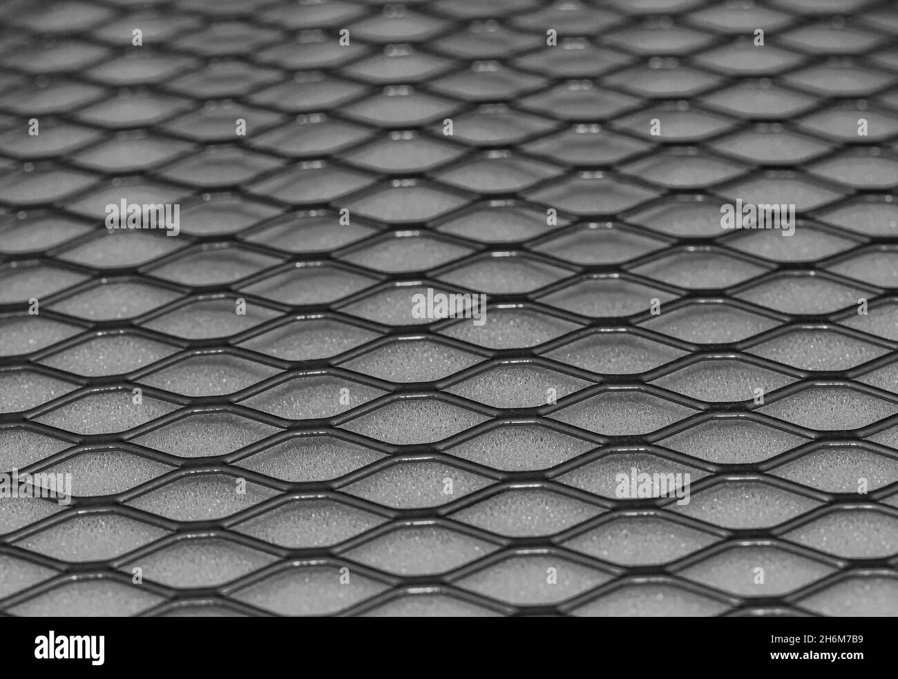 Metal grid with geometric pattern of rhombi, background. Black metallic ...
