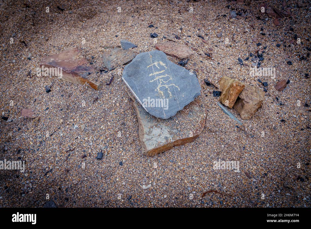 Stone saying 'fire' marks where a beach barbeque had been Stock Photo ...