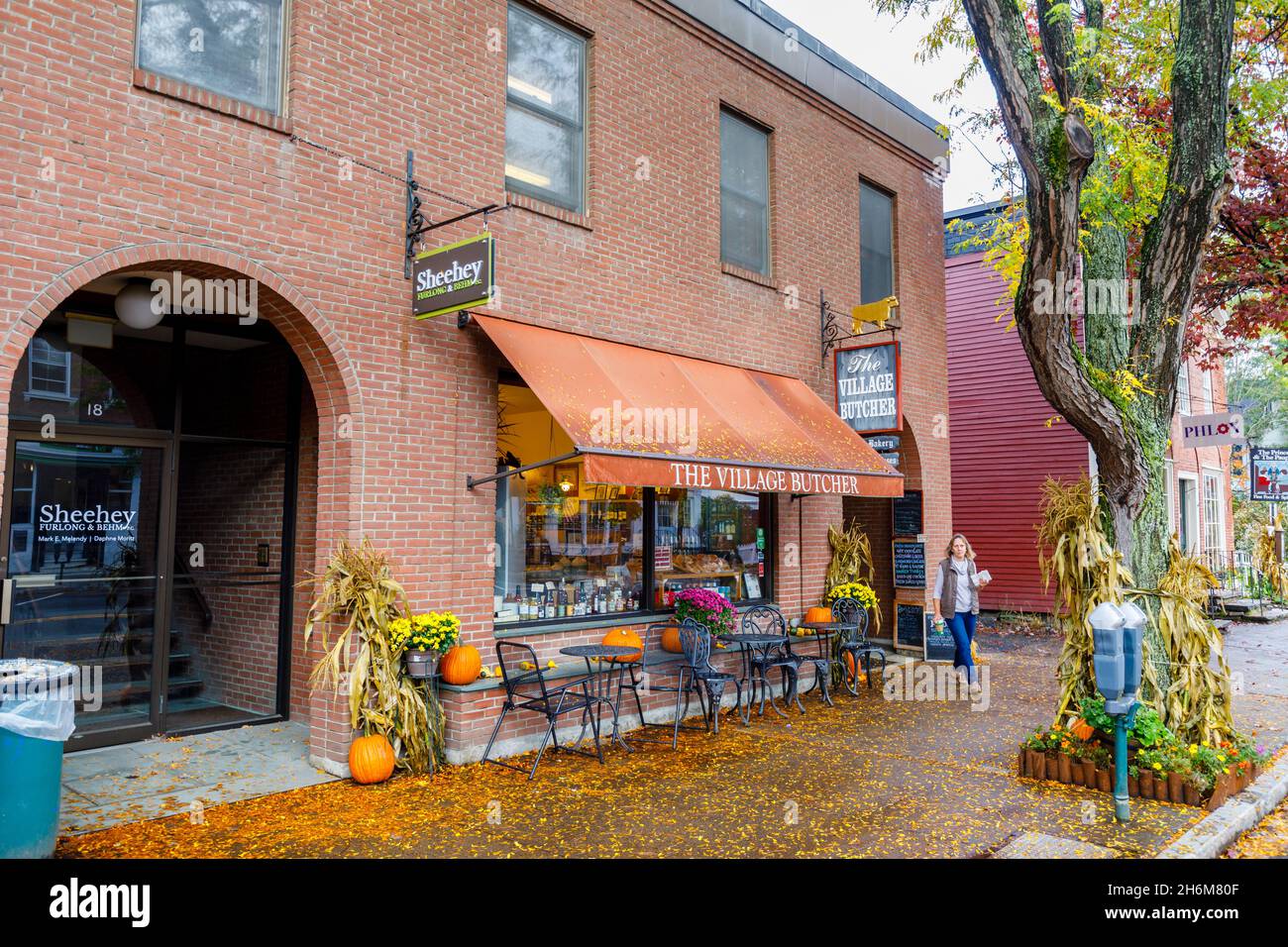 Brown awning above the shopfront of local deli 'The Village Butcher' in ...