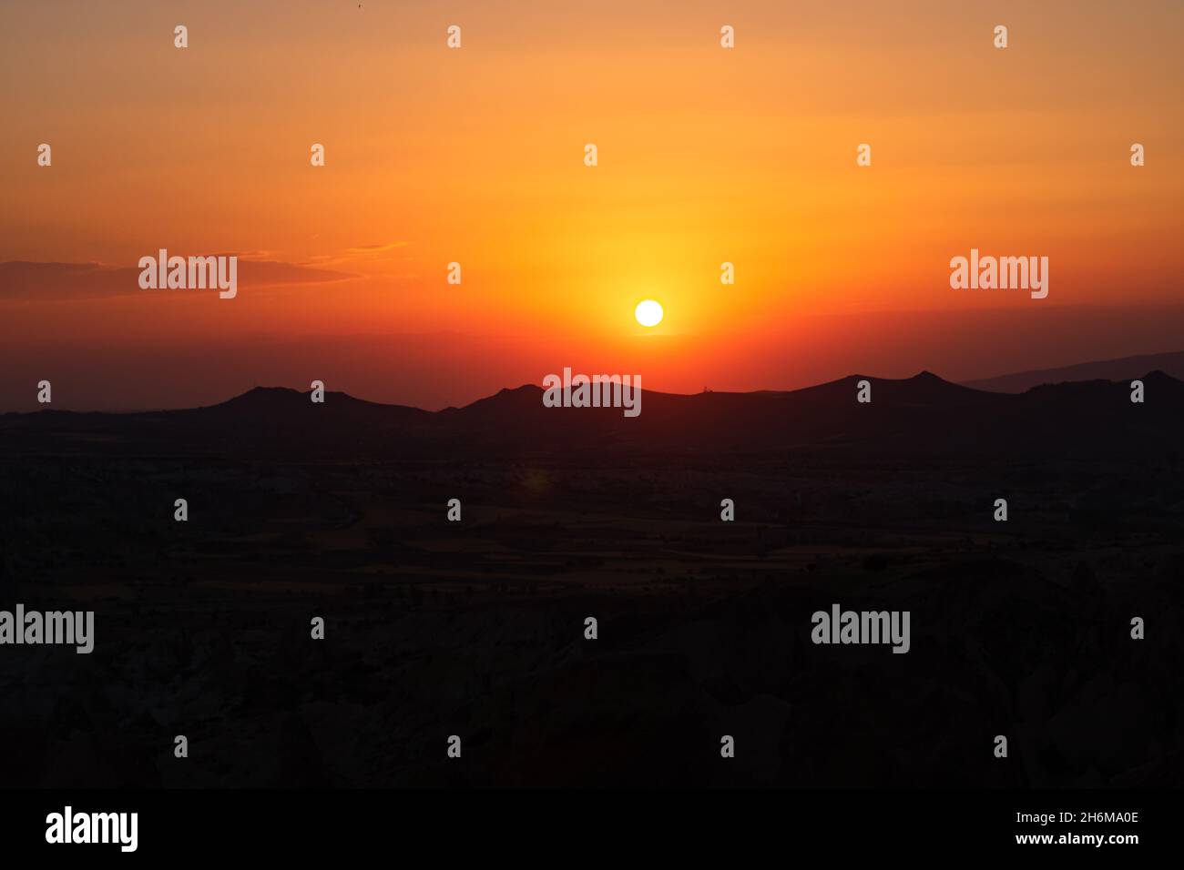 Sunset over the mountains. Sunset scene with silhouettes of mountains ...