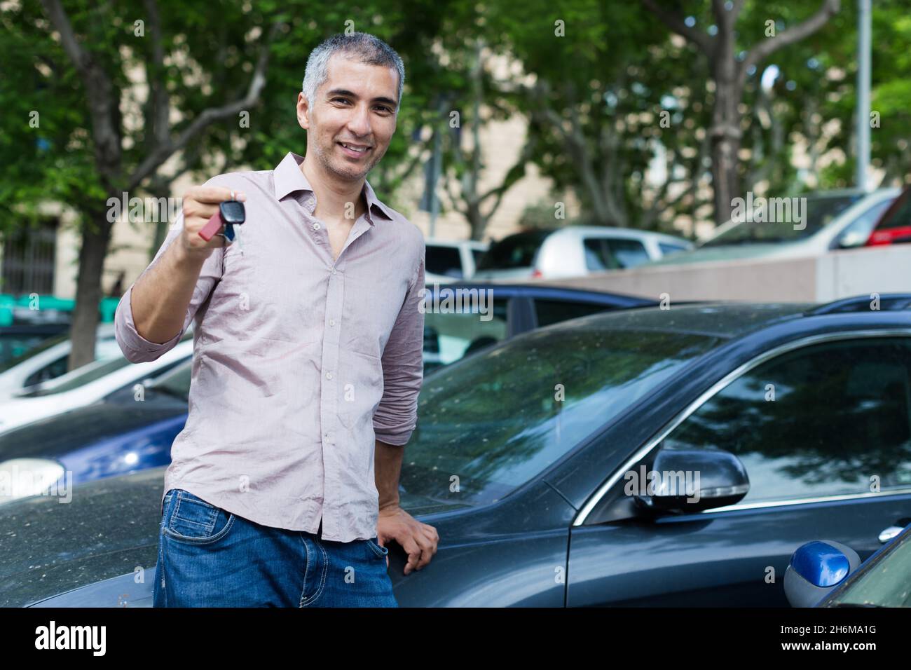 Portrait of man who is standing near his car Stock Photo - Alamy