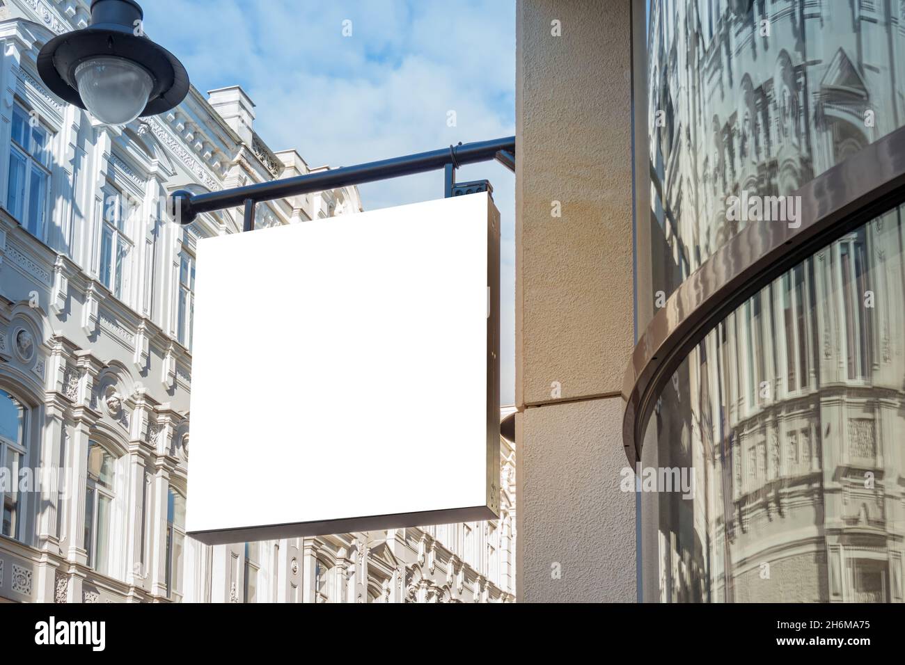 Mock up. Blank white rectangular shape signboard on the wall of ...