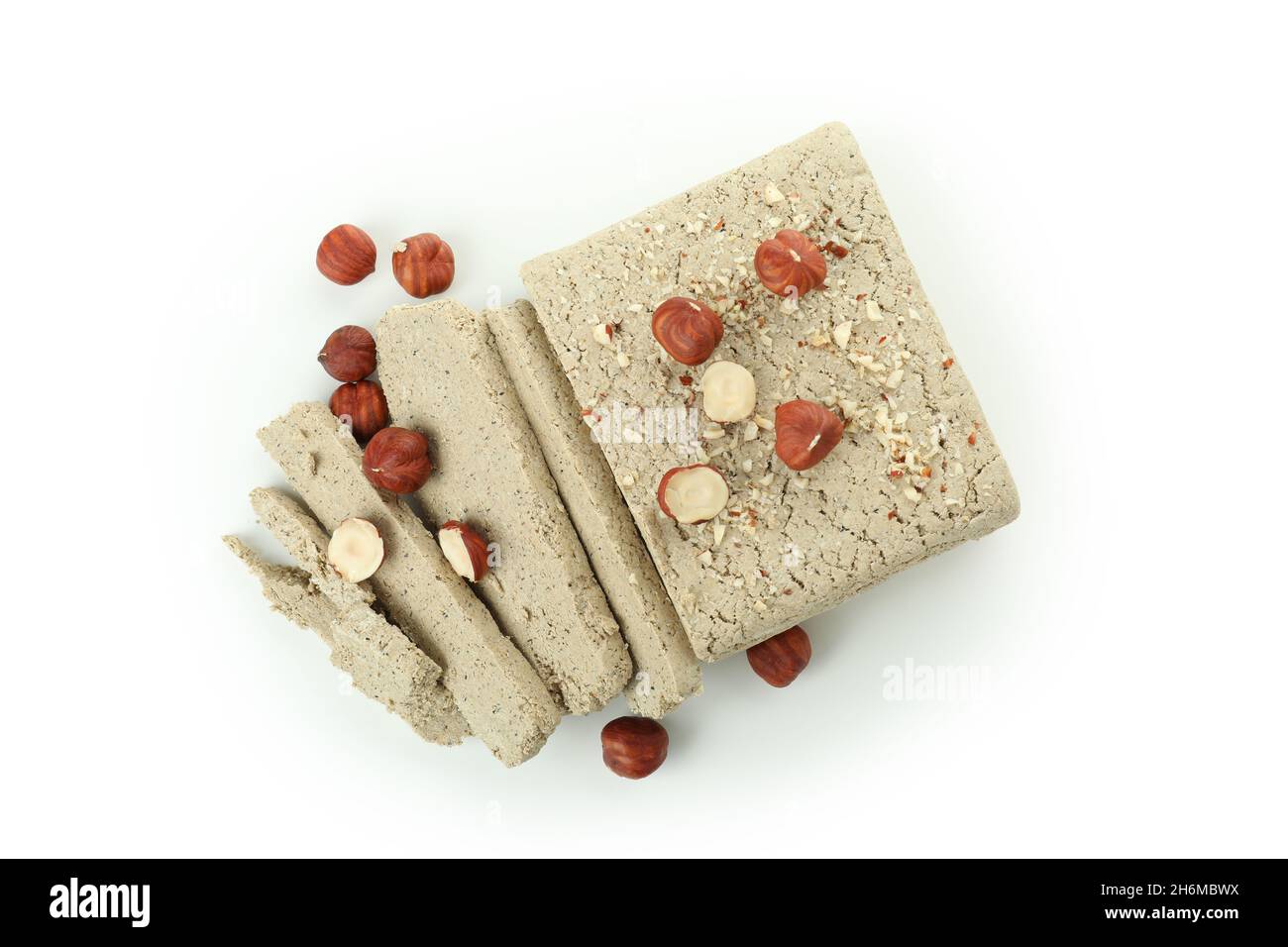 Halva with nuts isolated on white background Stock Photo - Alamy