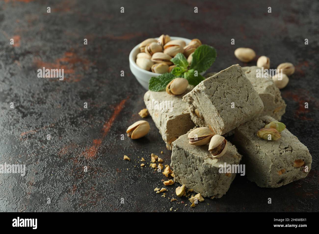 Concept of tasty food with halva on dark textured background Stock ...