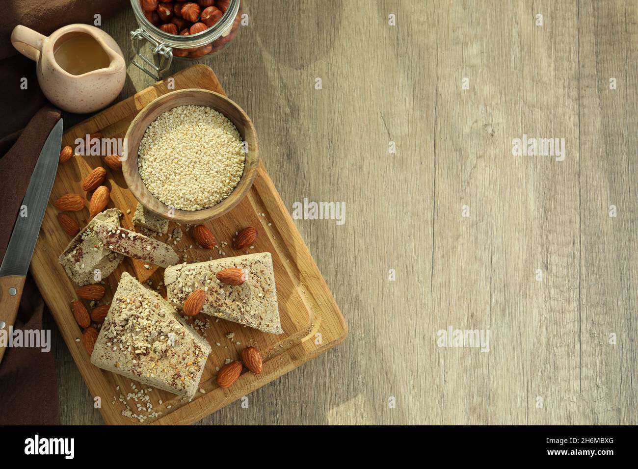 Concept of tasty food with halva on wooden background Stock Photo - Alamy