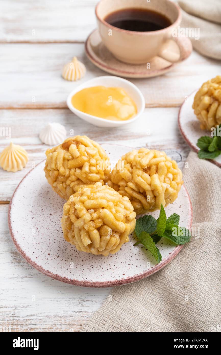 Traditional Tatar candy chak-chak made of dough and honey with cup of ...