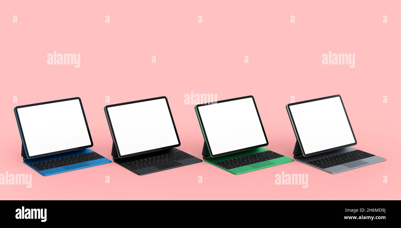 Set of computer tablets with keyboard and blank screen isolated on pink ...