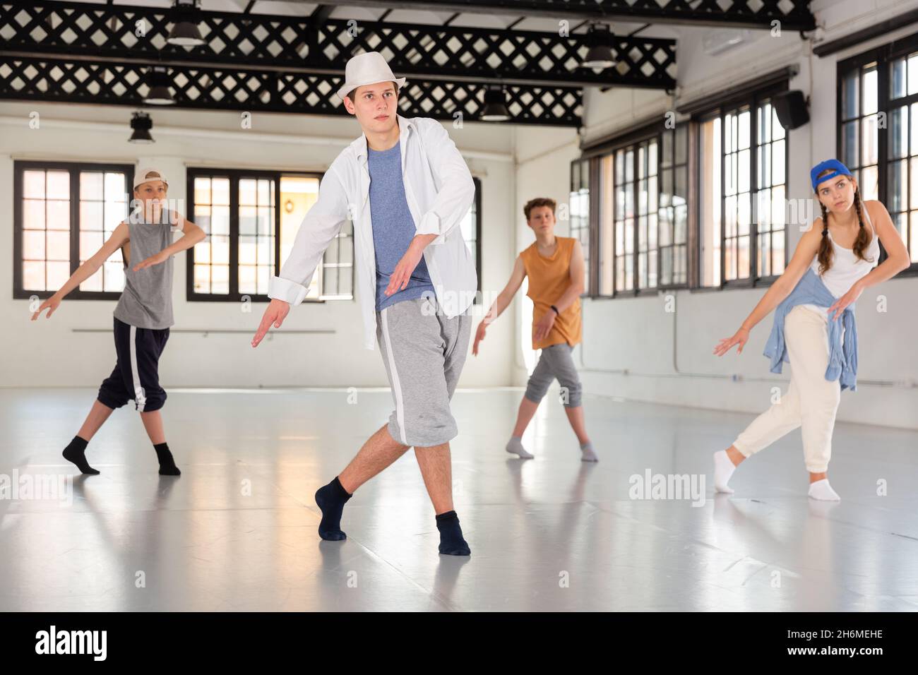 Teenage dancers practicing active dance at studio Stock Photo - Alamy
