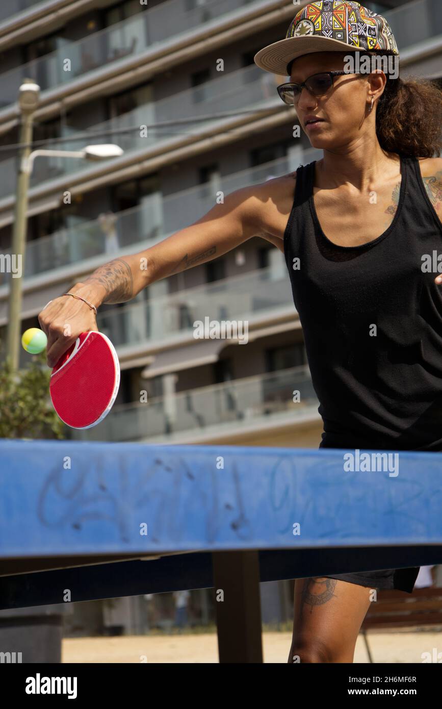 Latin woman playing ping pong Stock Photo - Alamy