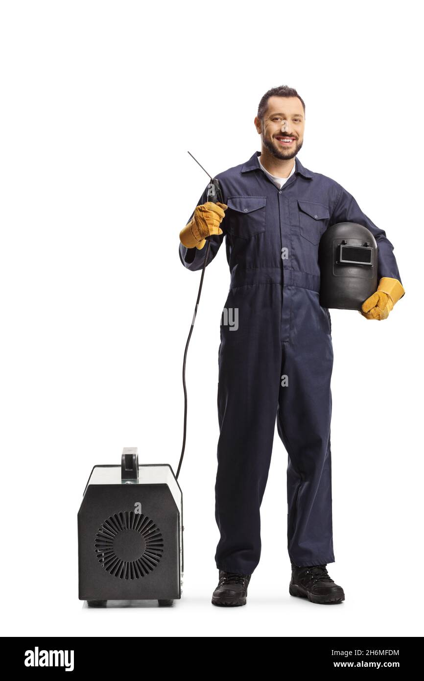 Full length portrait of a welder in a uniform holding a welding ...