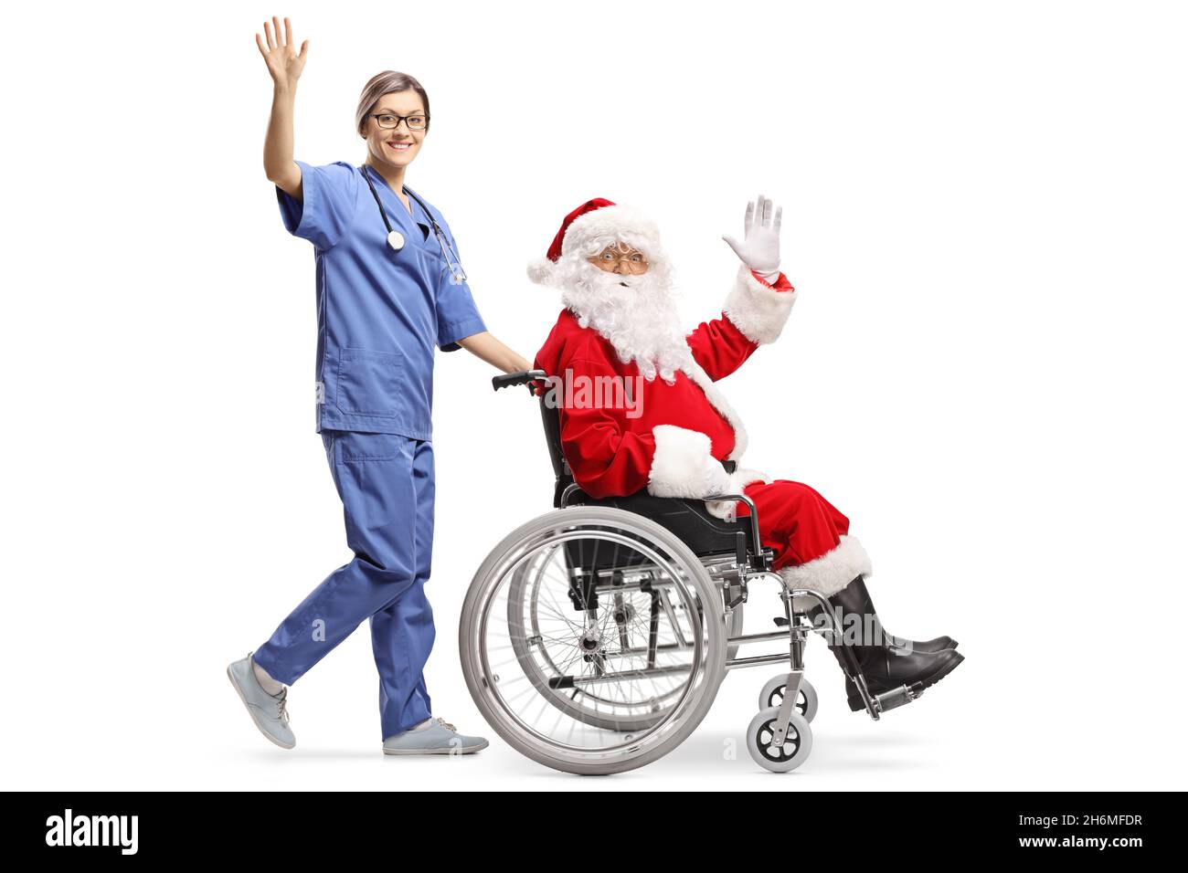 Full length profile shot of a female nurse pushing santa claus in a ...