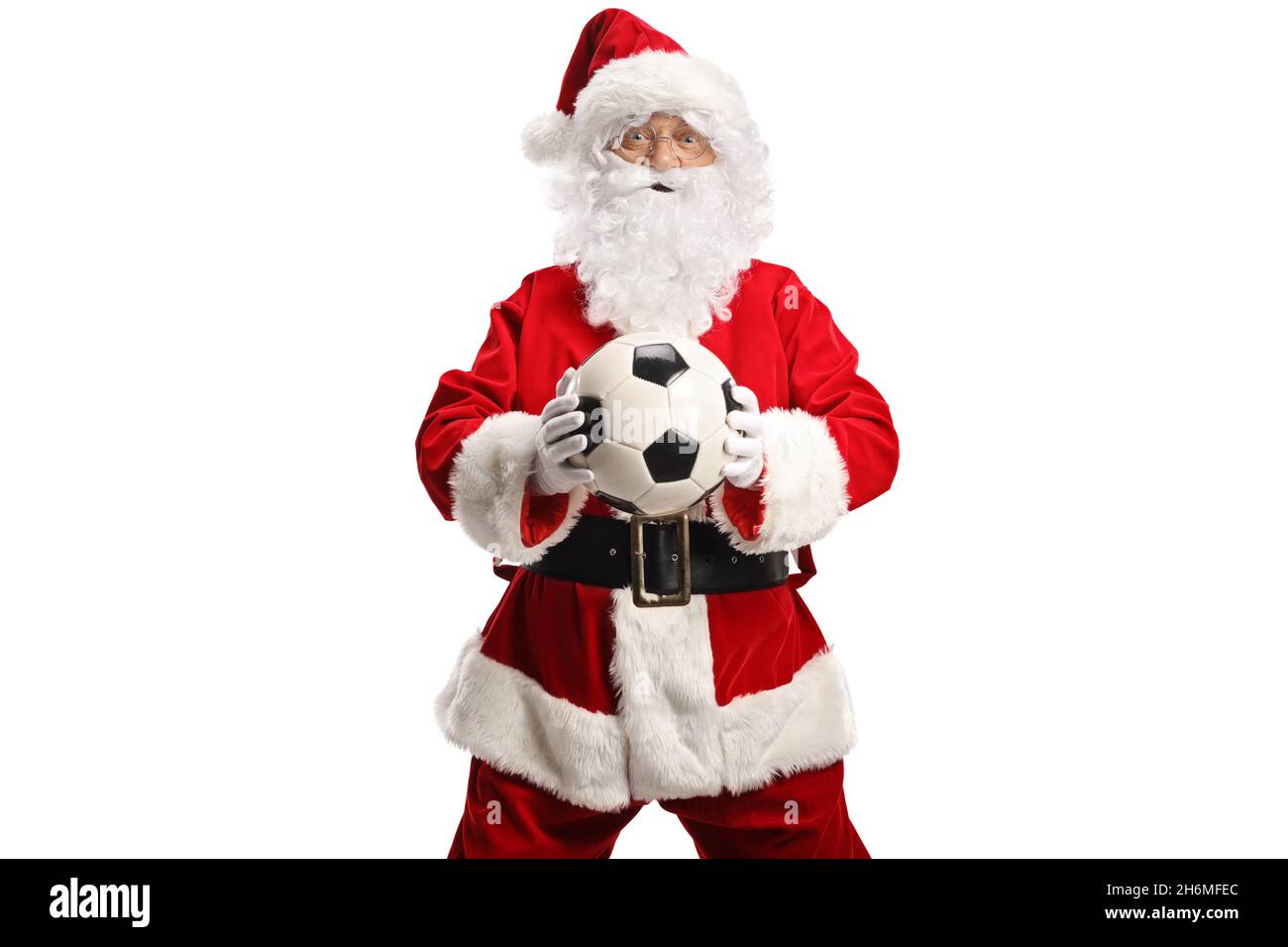 Santa claus holding a football isolated on white background Stock Photo ...