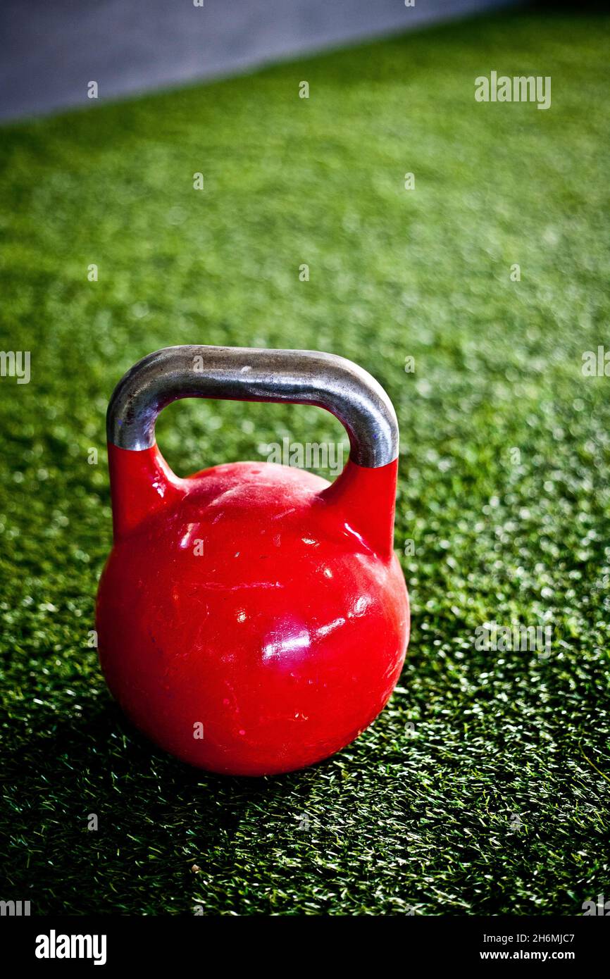 red kettlebell on the floor in a gym Stock Photo - Alamy