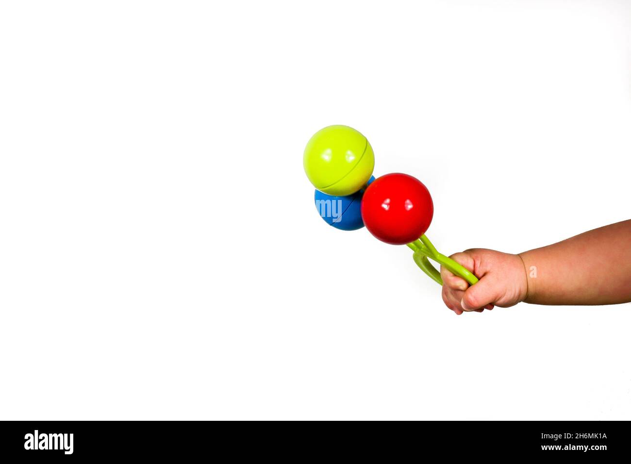 baby rattle in baby hand Stock Photo - Alamy