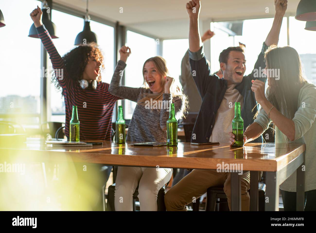 Excited office colleagues celebrating in office Stock Photo - Alamy
