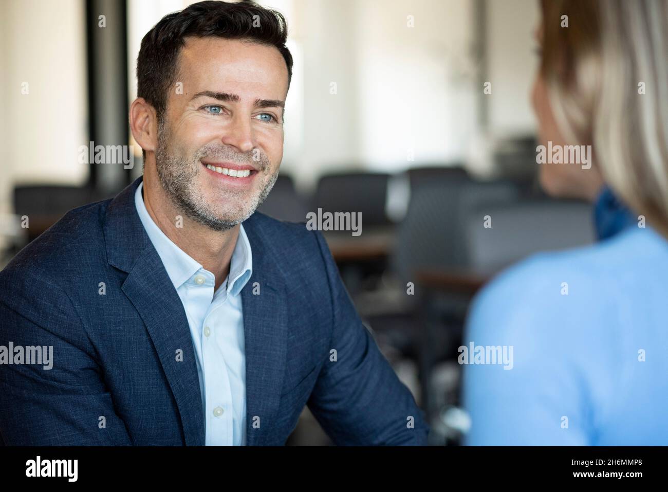 Mature male talking colleague hi-res stock photography and images - Alamy