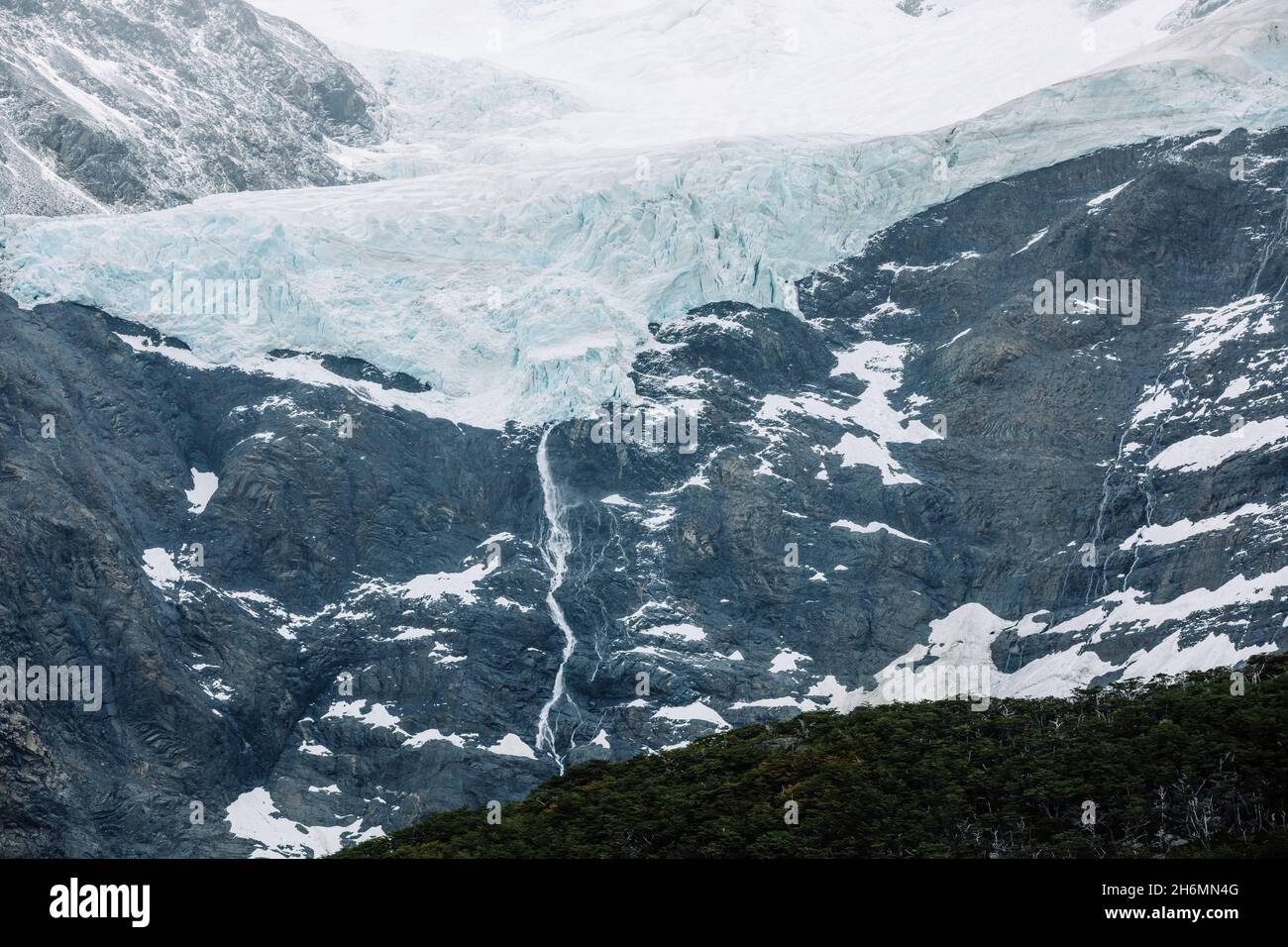 Small stream of melting water flowing from the glacier, Torres del ...
