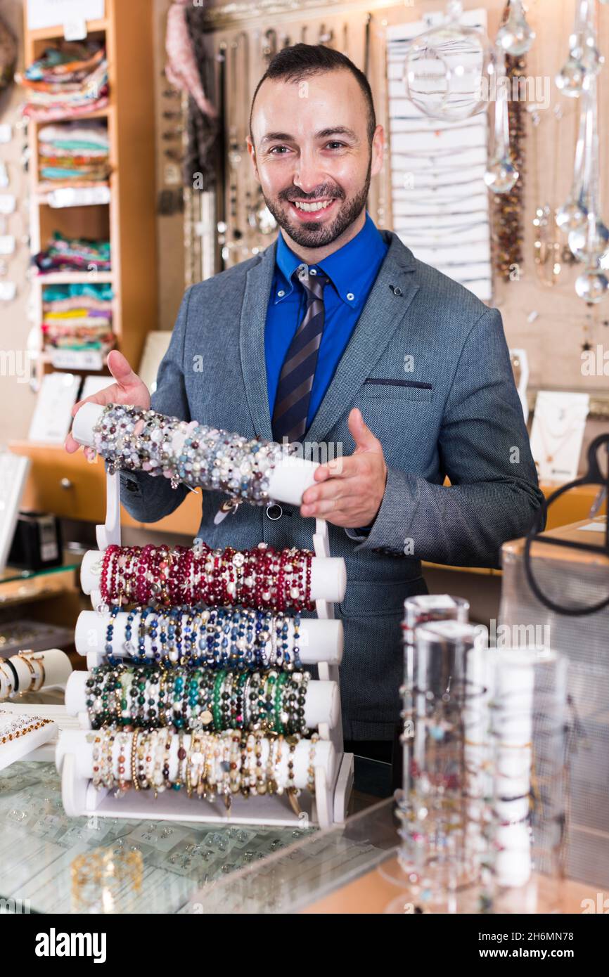 seller showing bracelets in the jewelry shop Stock Photo - Alamy