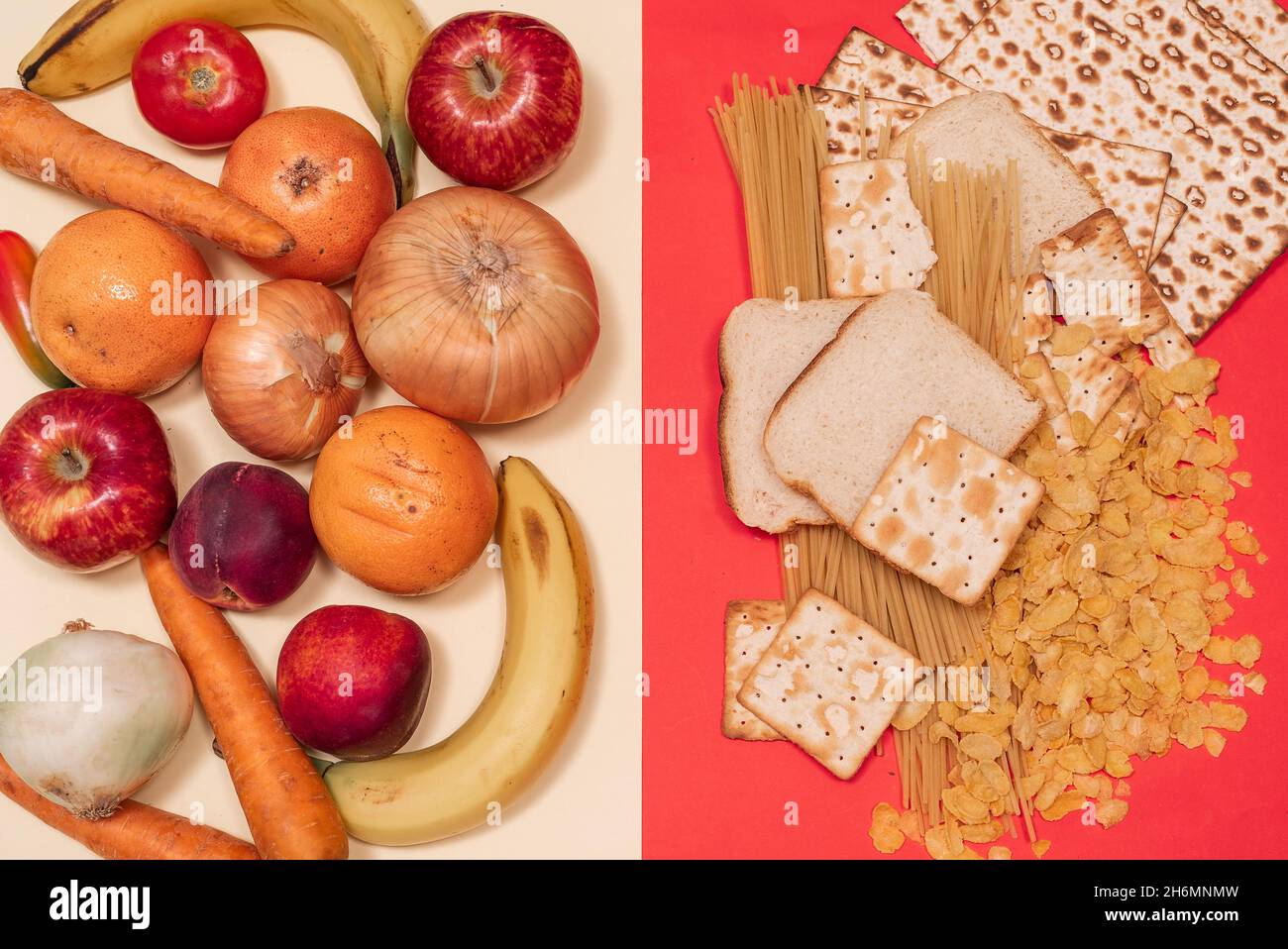 Top view of fruits, vegetables, and different carbs on a white and red ...
