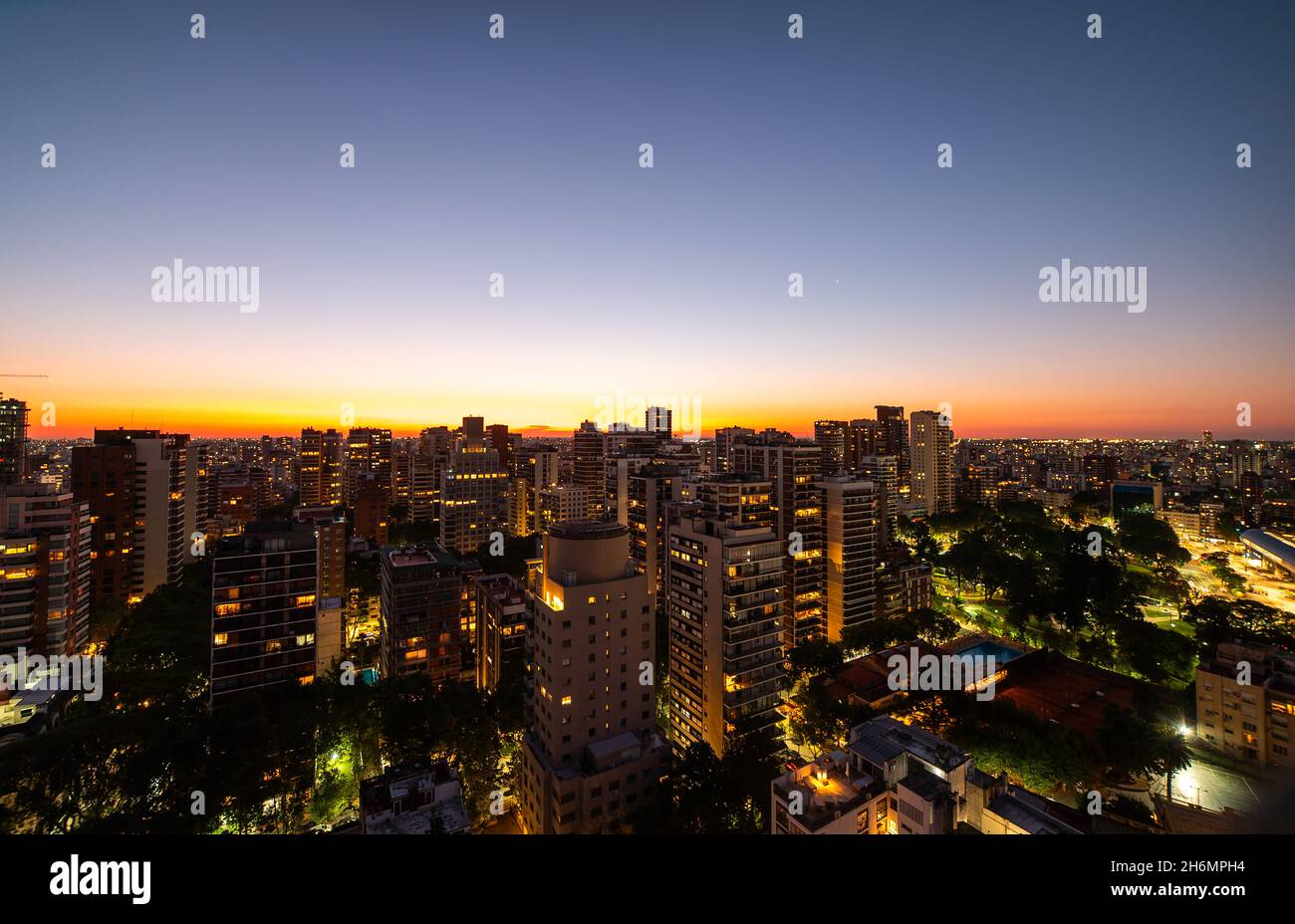 Aerial view of crowded cityscape with high rise buildings at dusk Stock ...