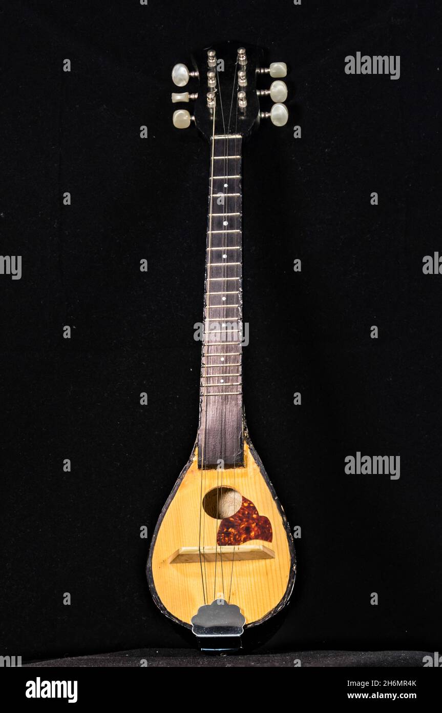 National Greek musical instrument Baglamas isolated on a black ...