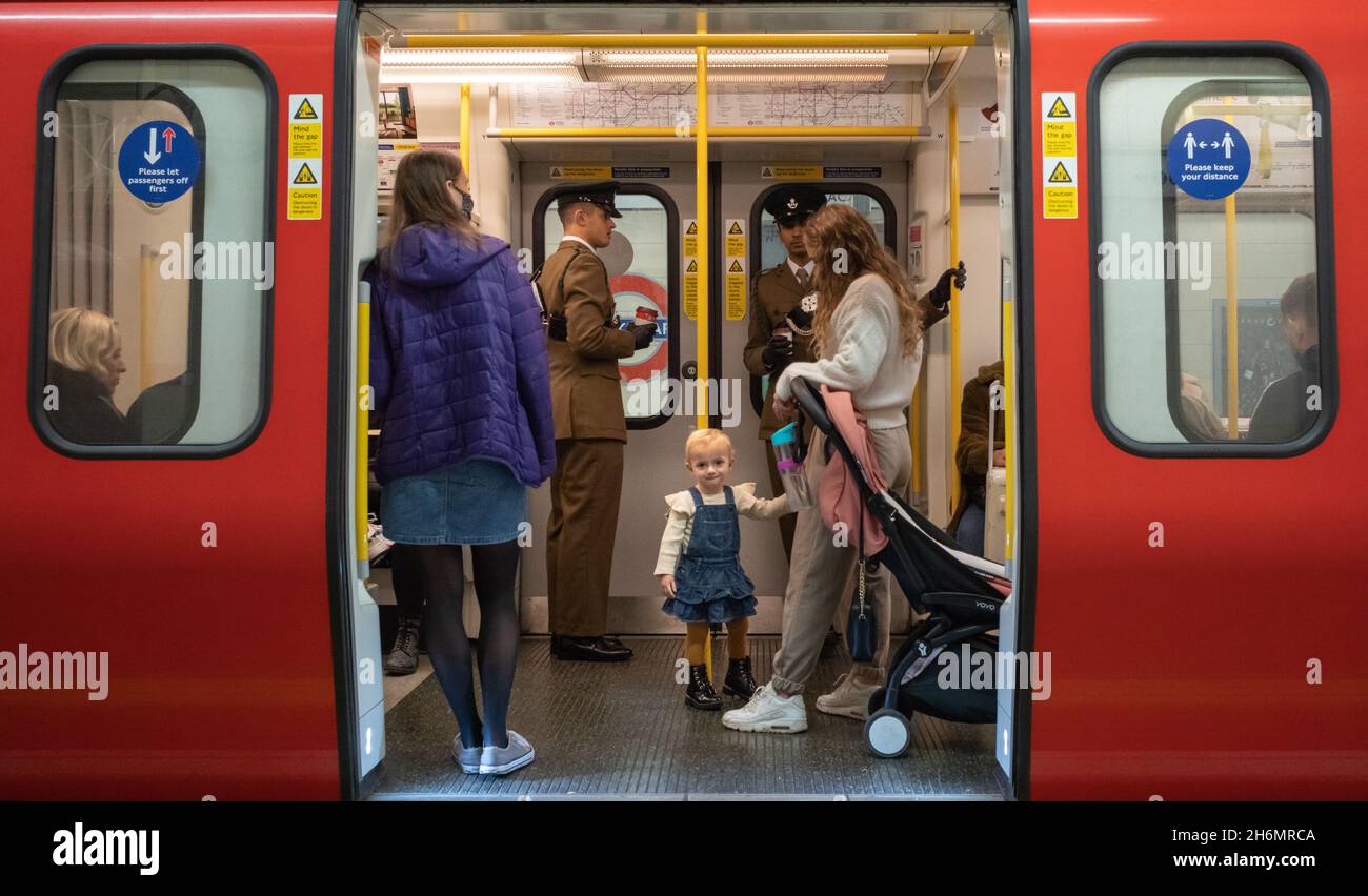 A young girl looks out of a London tube train as it waits on a District ...