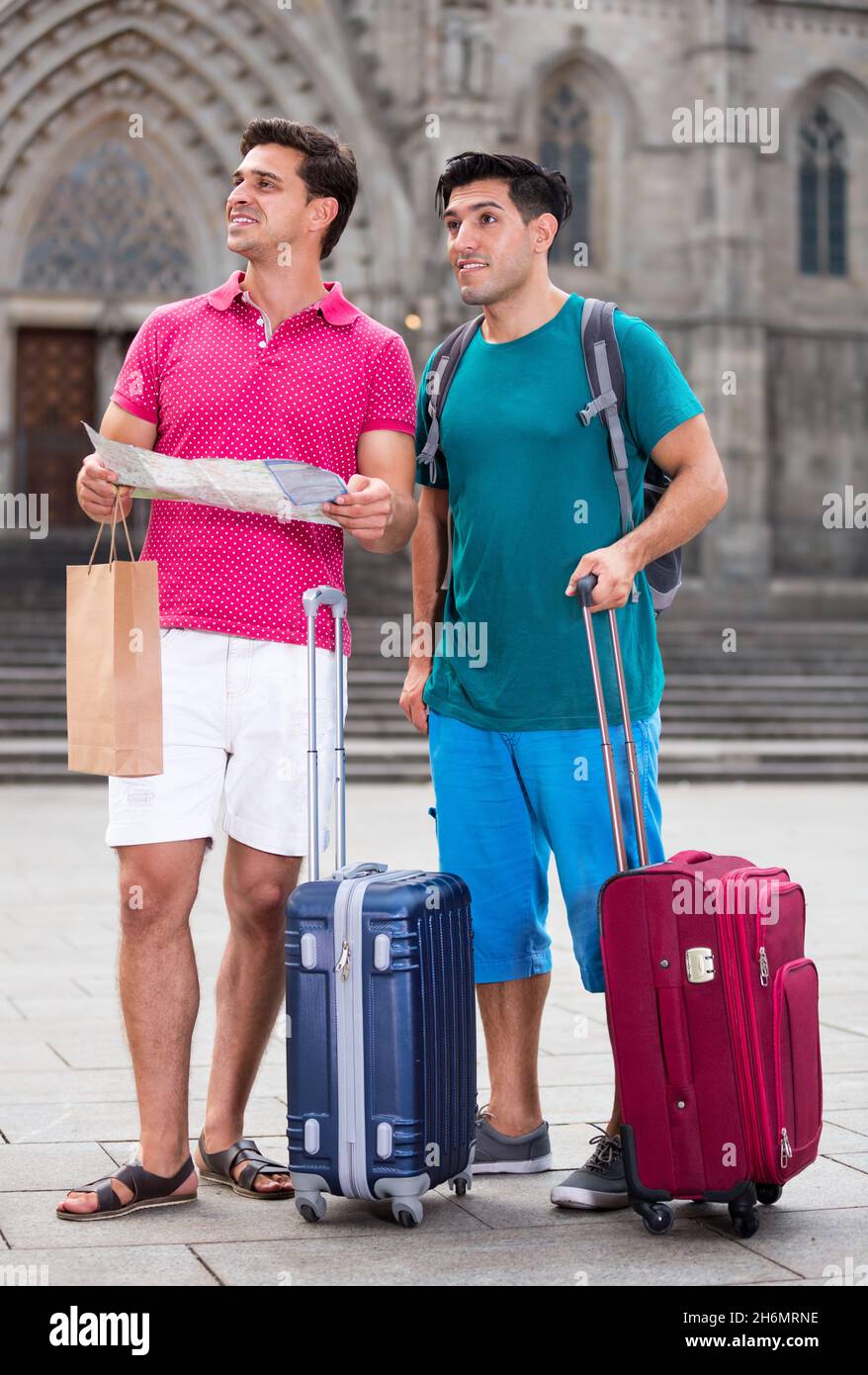 Tourists are watching in map and searching way Stock Photo - Alamy