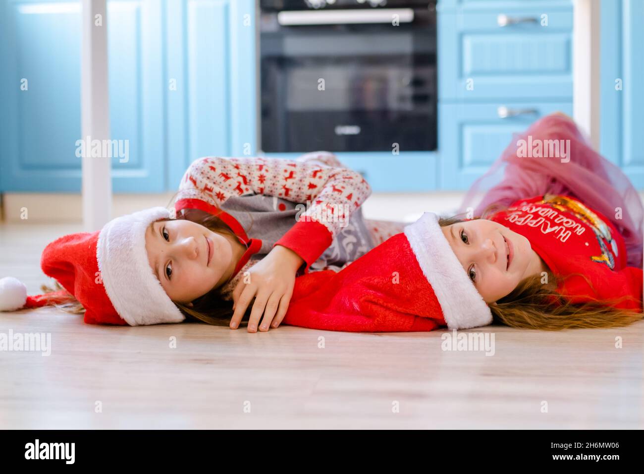 Happy children lie on floor hi-res stock photography and images - Alamy