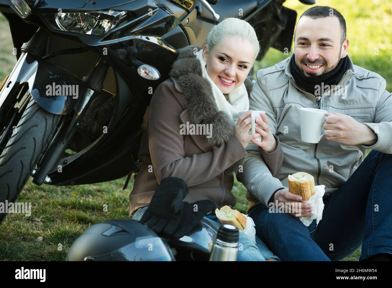 young adults drinking coffee Stock Photo - Alamy