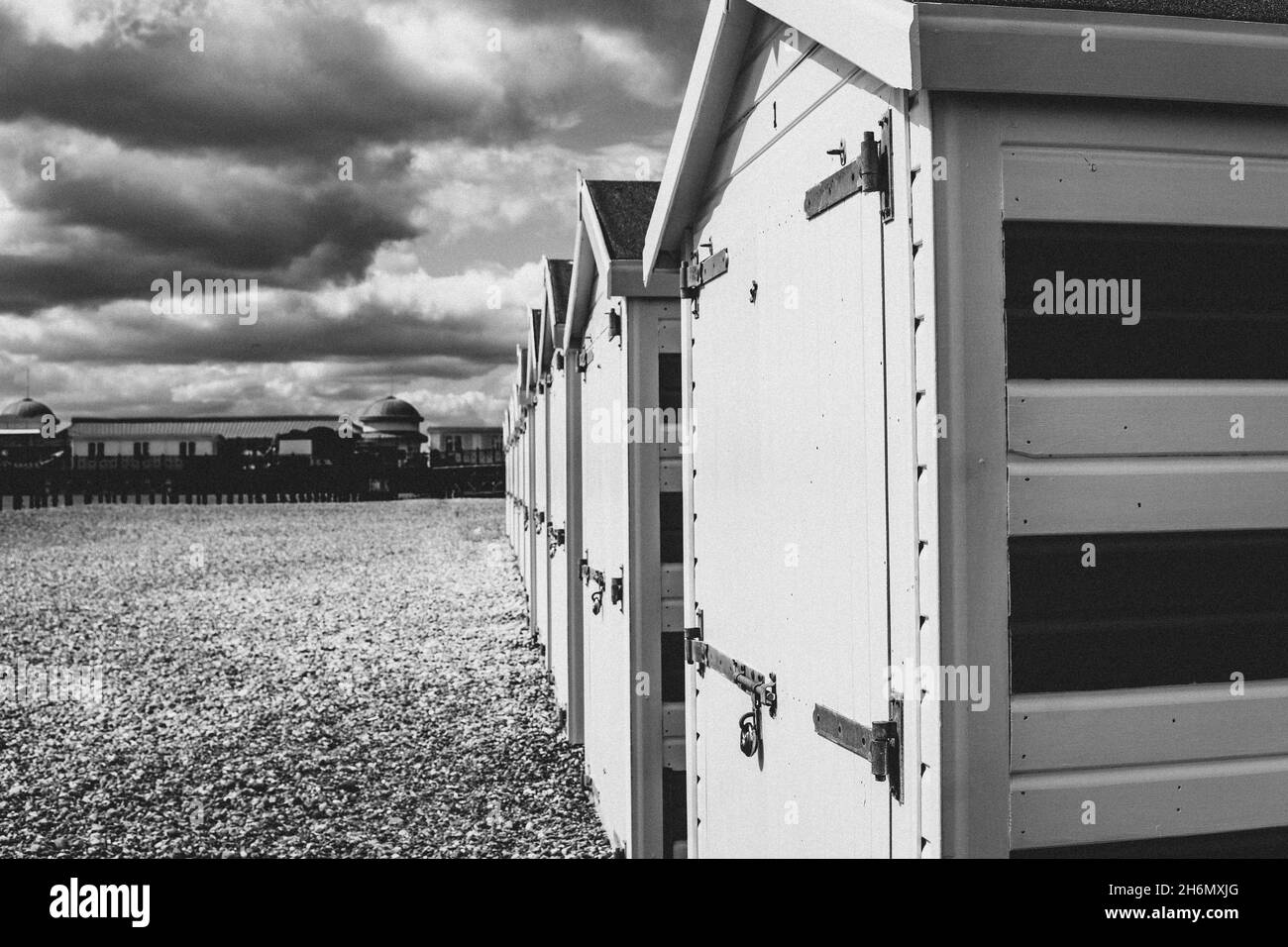 Grayscale shot of the changing sheds on the Hastings beach Stock Photo ...