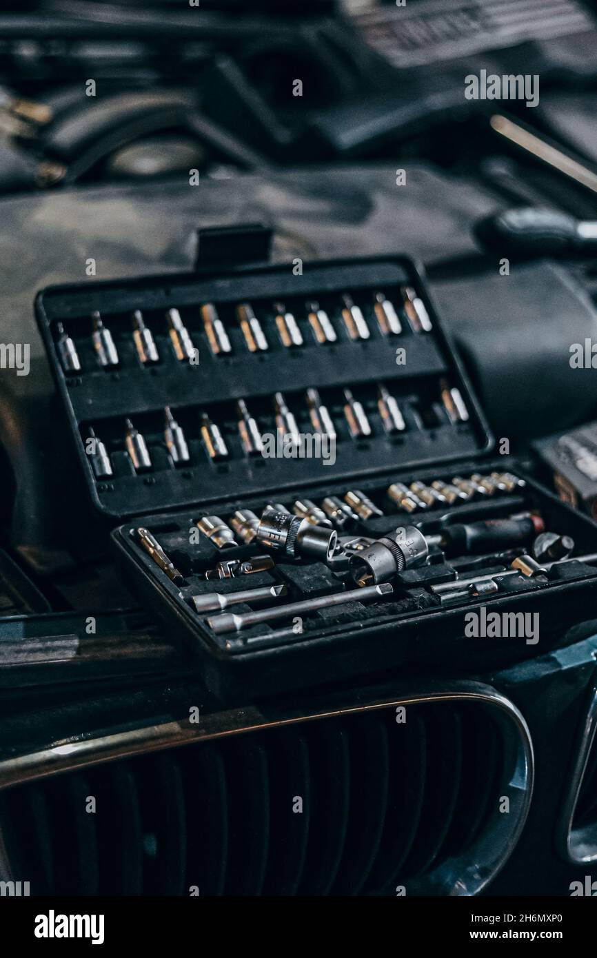 An open toolbox lies on the floor in the garage. Side view Stock Photo ...