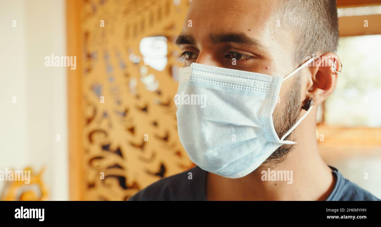 Young Indian guy in a facial mask Stock Photo - Alamy