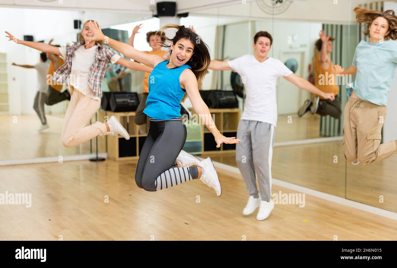 Teenagers dancers jumping in studio Stock Photo - Alamy