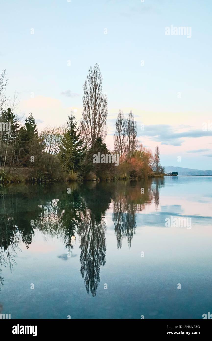 Autumn trees reflecting in calm hi-res stock photography and images - Alamy
