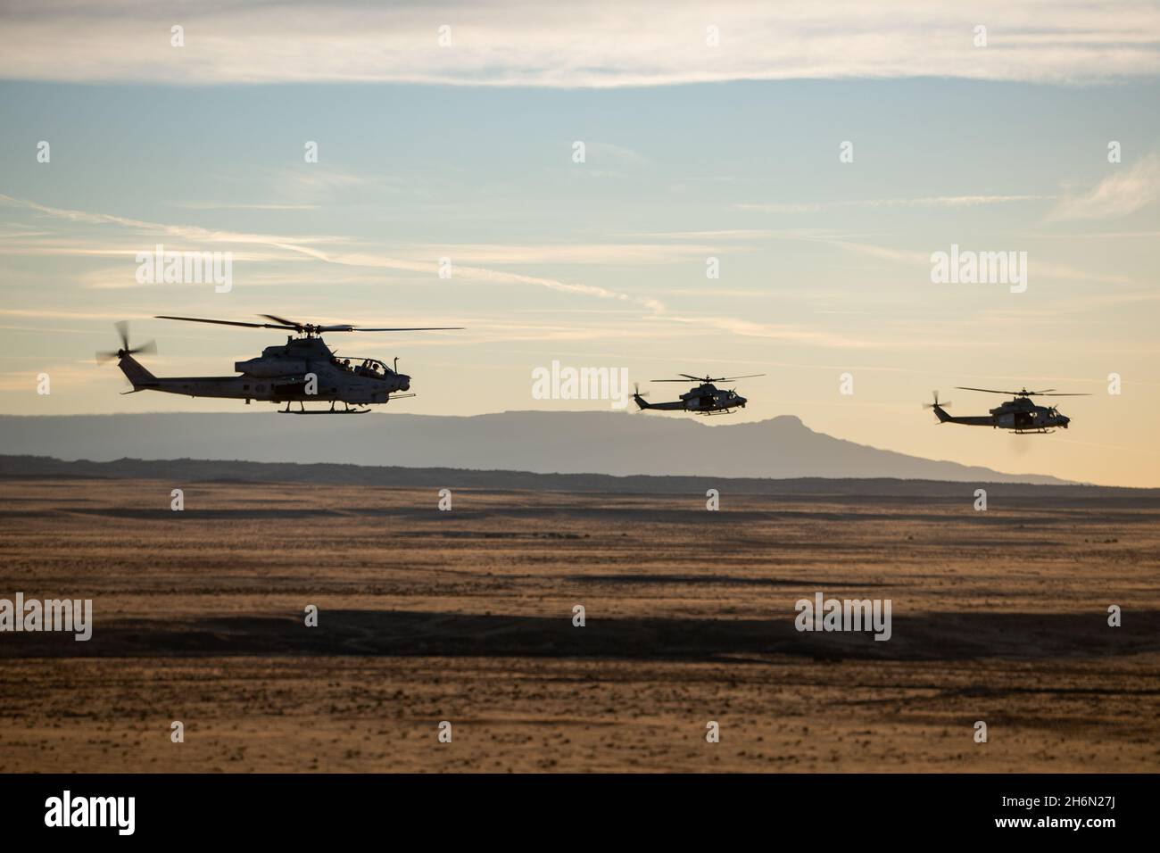 An AH-1Z Viper helicopter and two UH-1Y Venom helicopters assigned to ...