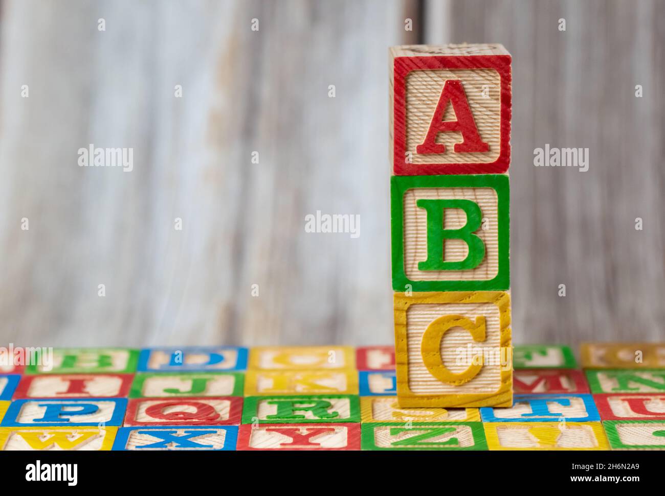 ABC wooden block stack vertically on blocks Stock Photo - Alamy