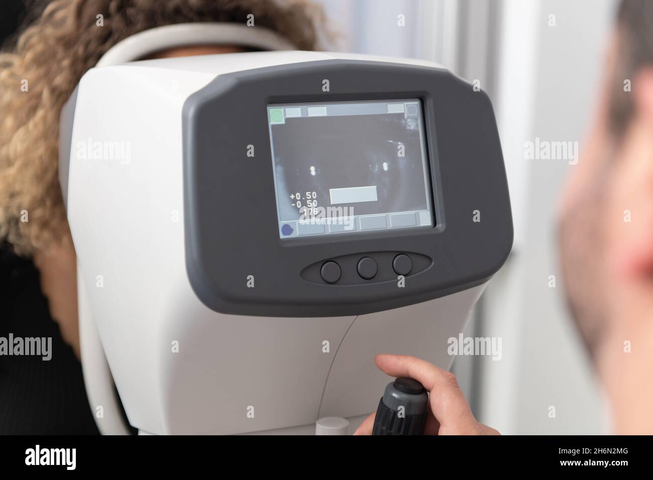 Woman Looking at Refractometer Eye Test Machine in Ophthalmology Stock ...