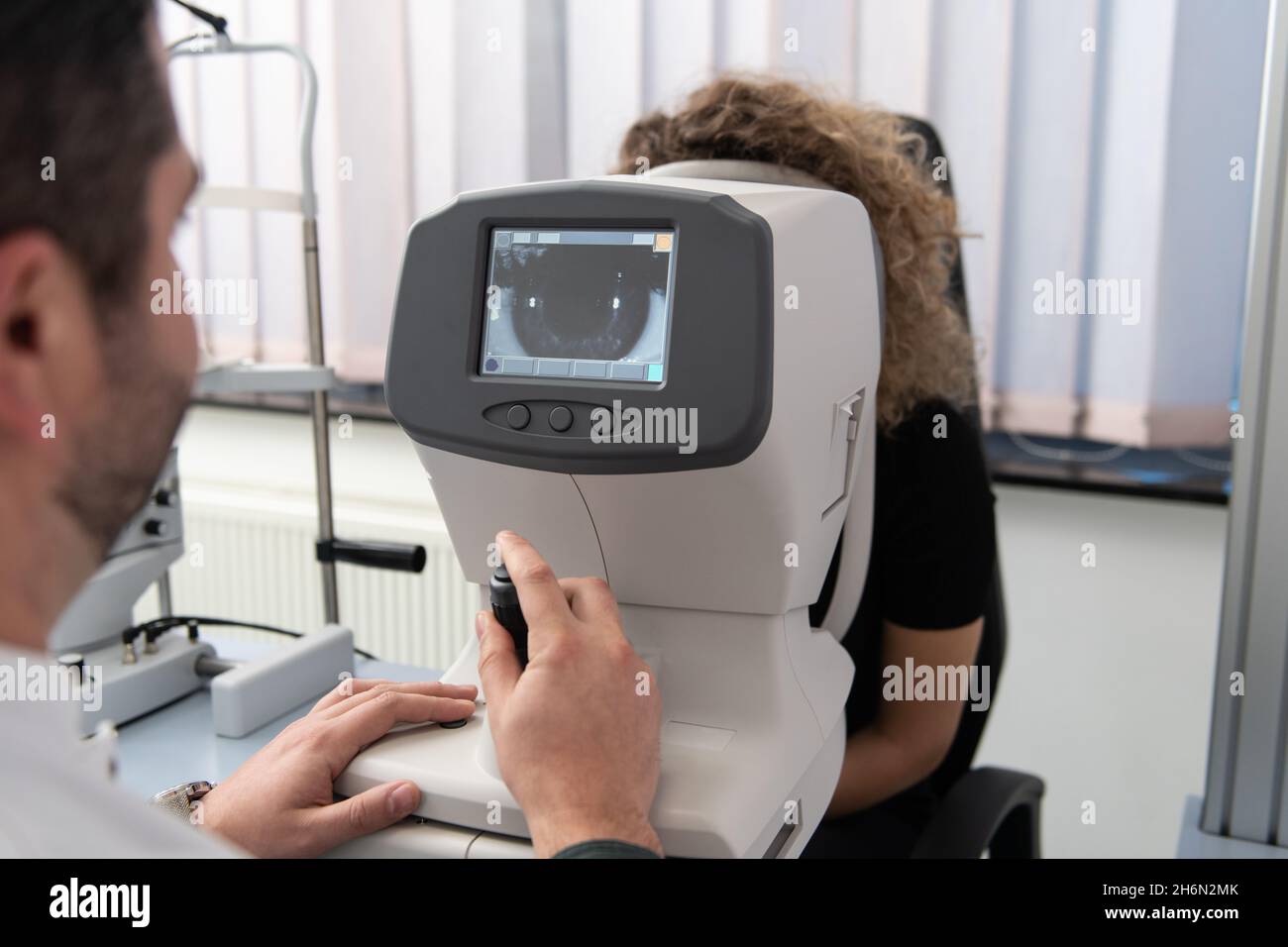 Woman Looking at Refractometer Eye Test Machine in Ophthalmology Stock ...