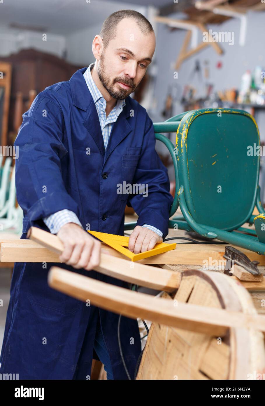 Carpenter repairing antique chair Stock Photo - Alamy
