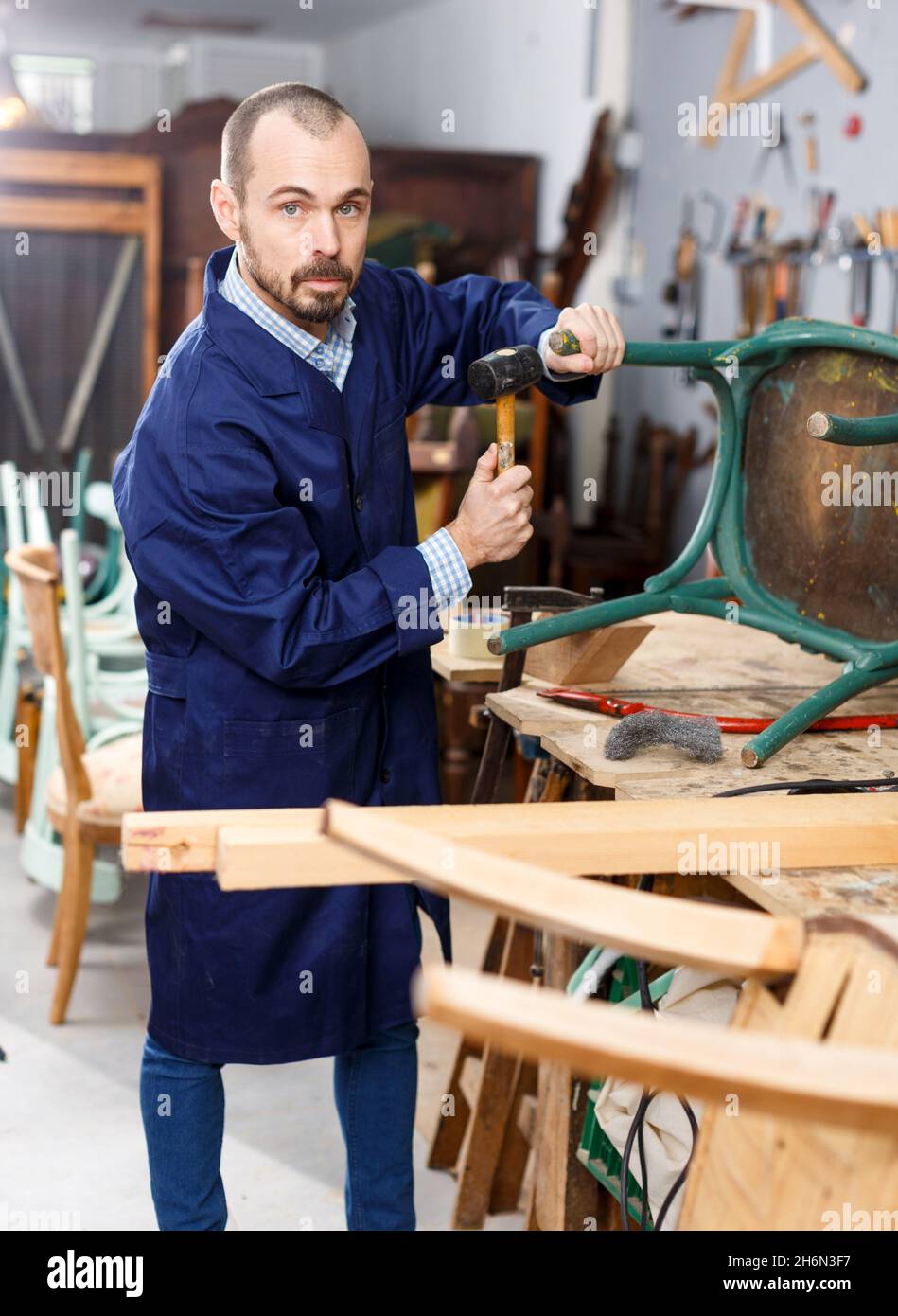 Craftsman using carpentry tools for restoration Stock Photo - Alamy