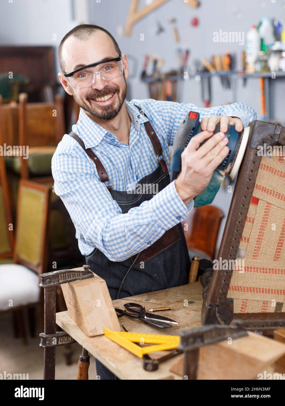 Craftsman repairing antique furniture Stock Photo - Alamy