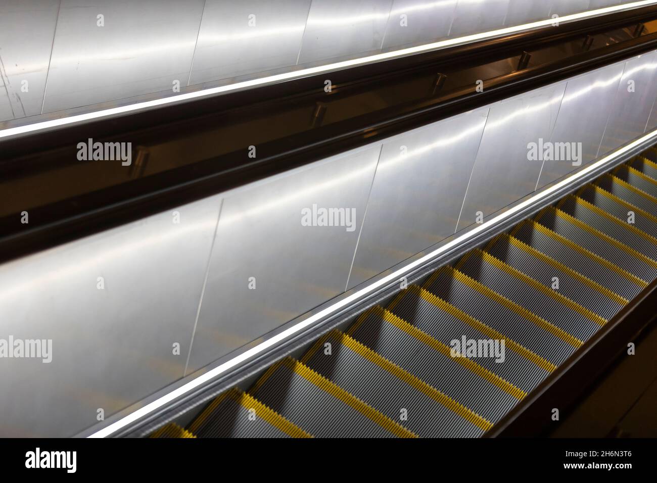 An illuminated escalator at the new Link Light Rail Northgate Station ...